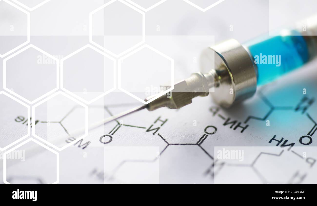 small jars with injection and syringe for injection on blue background ...