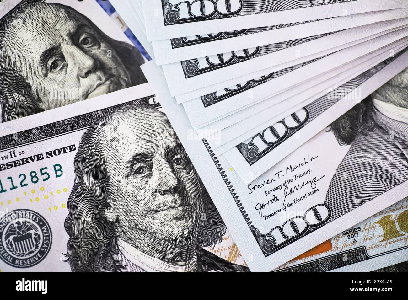 Cash money in a large pile as a finance background. Paper money close ...