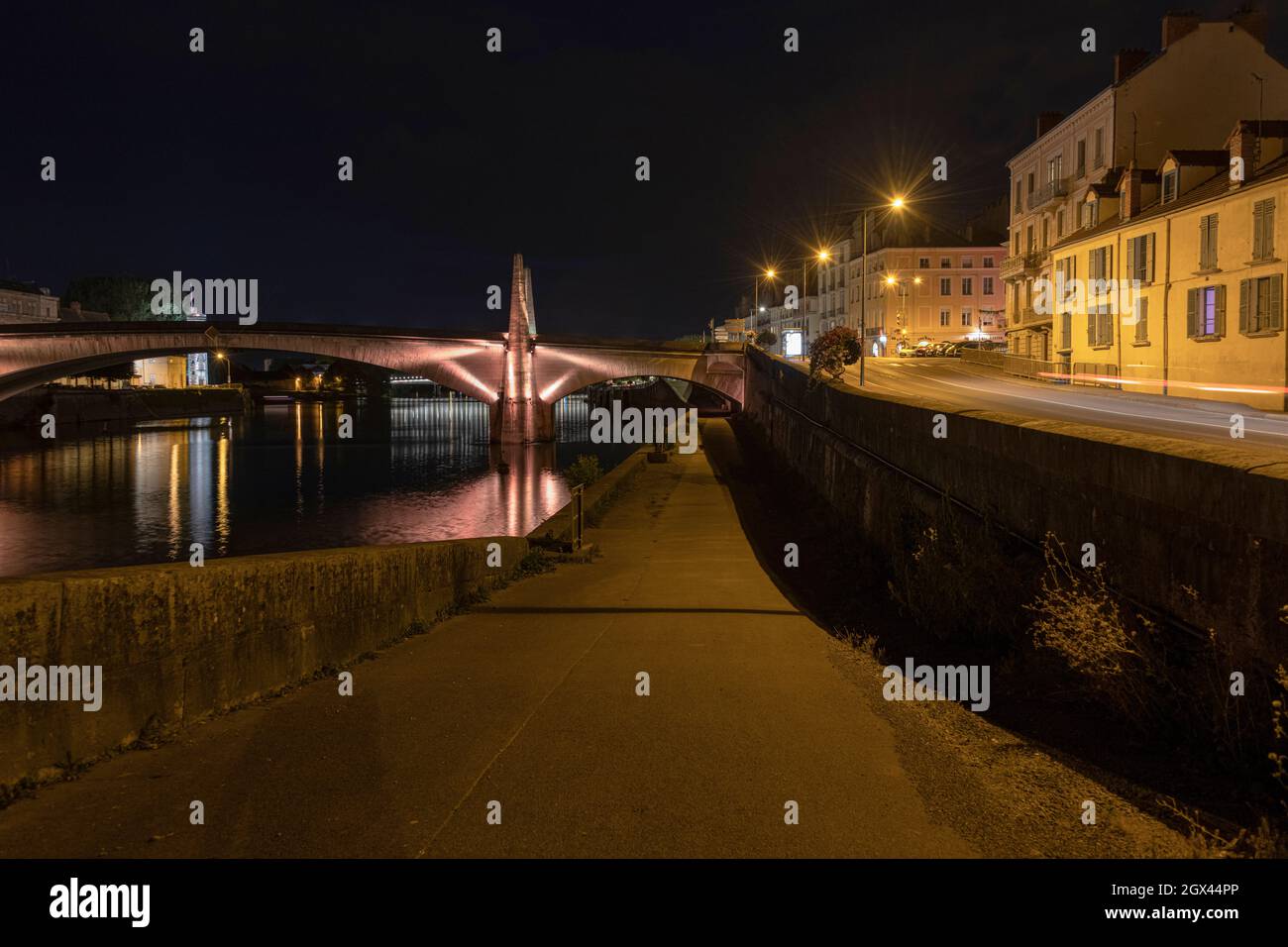 The Quayside and The Saint Laurent Bridge in Chaon-Sur-Saone at night ...