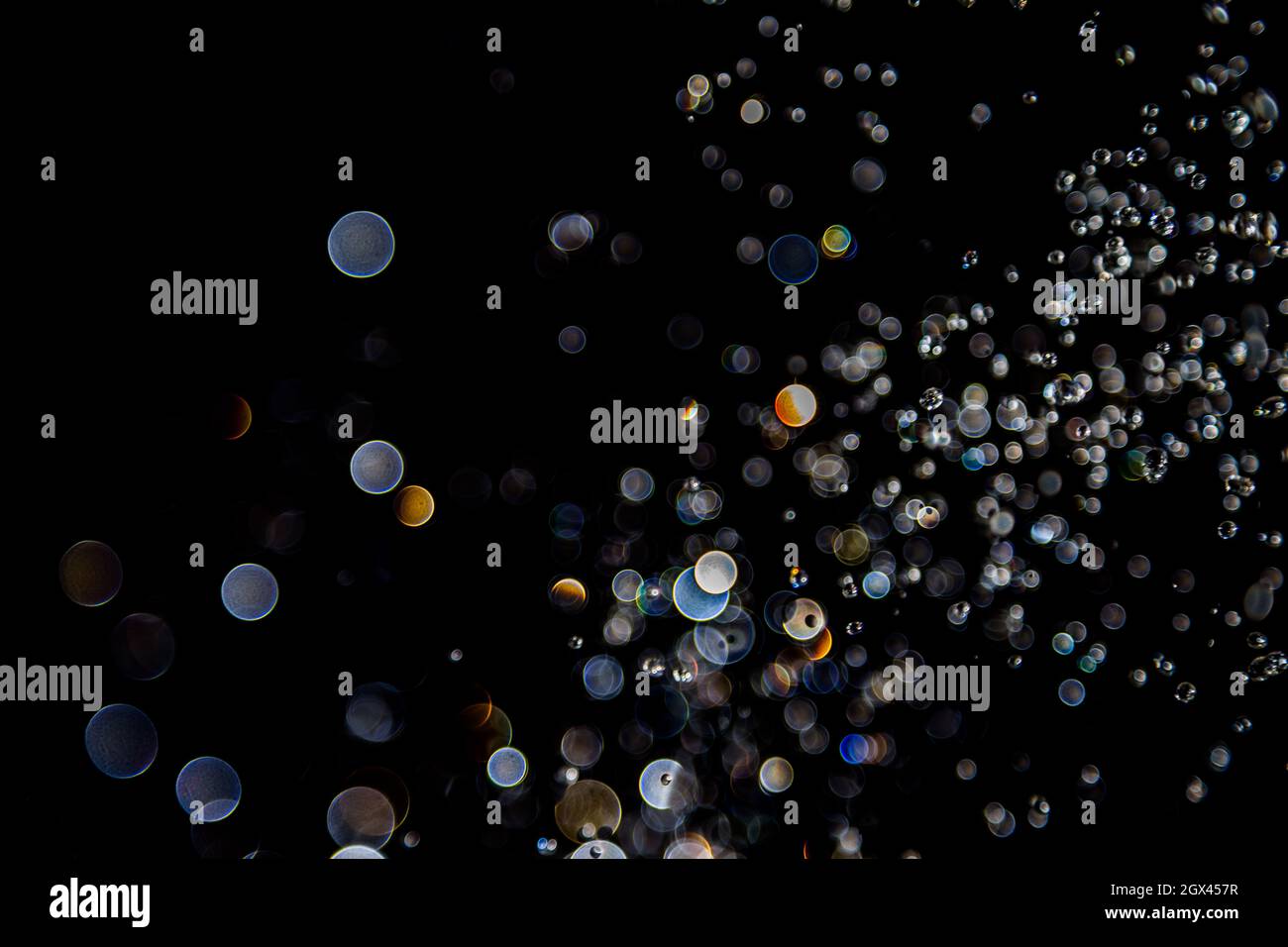 bokeh of water drops levitating in the air reflection with light Stock ...