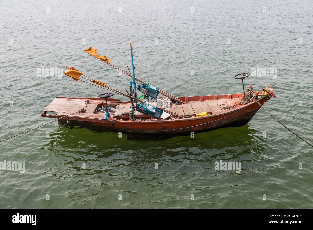 Orange wood fishing boat at Thailand Stock Photo - Alamy