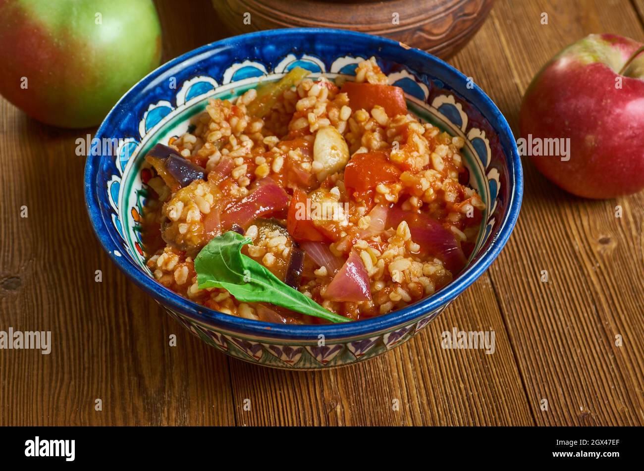 Palestinian Shulbato - Red Bulgur with Eggplant Stock Photo - Alamy