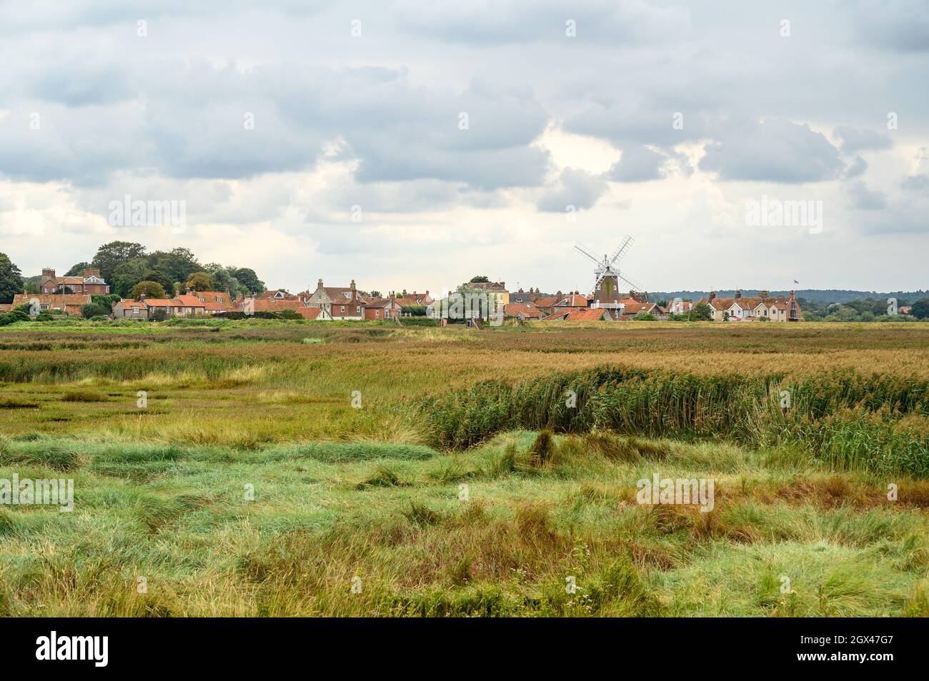 View over freshwater marshes to Cley next the Sea village with Cley ...