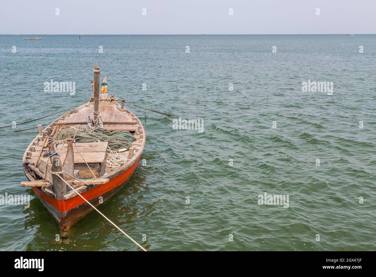 Orange wood fishing boat at Thailand Stock Photo - Alamy