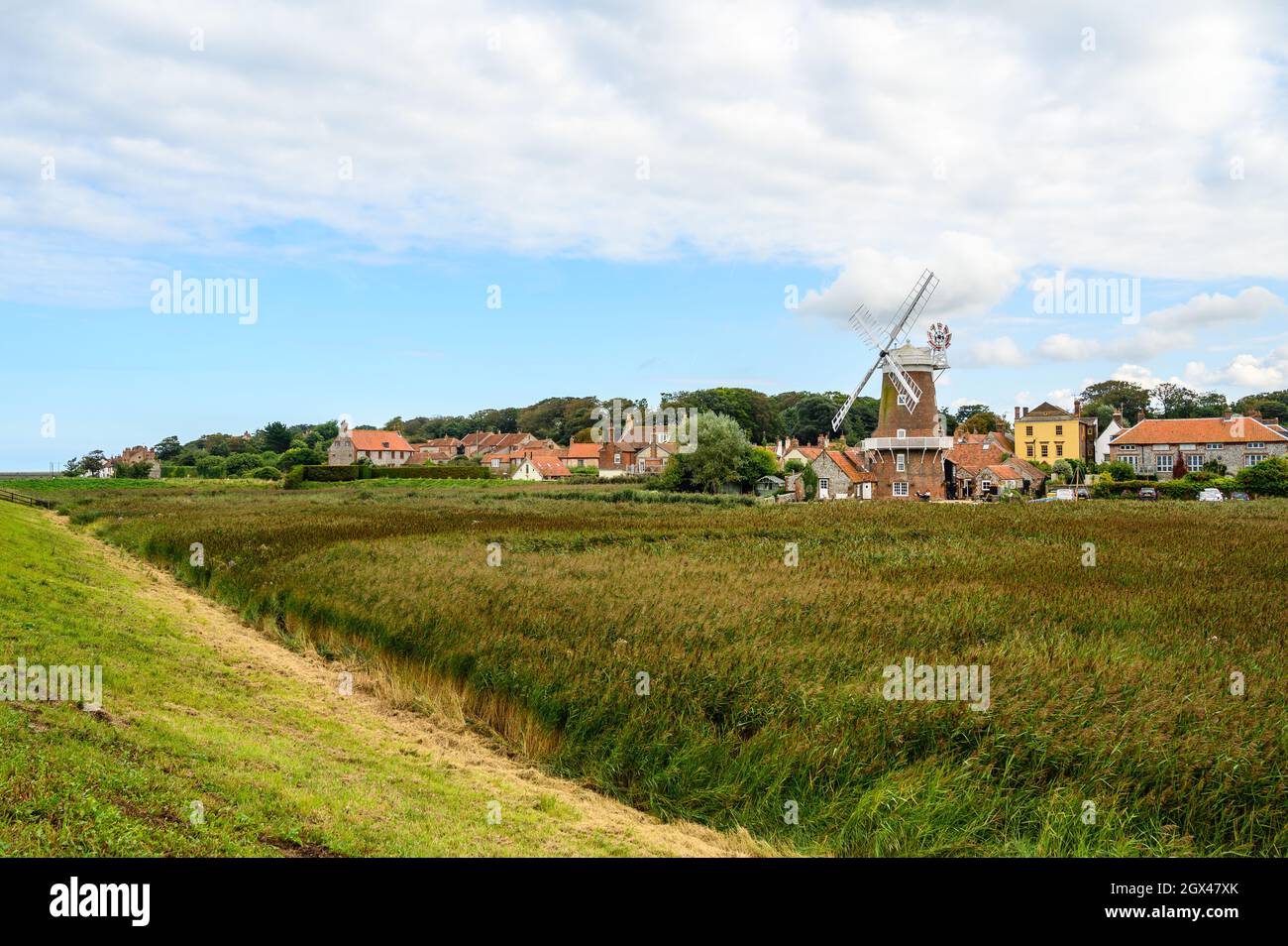 Cley on the Sea village with its windmill seen from a public footpath ...