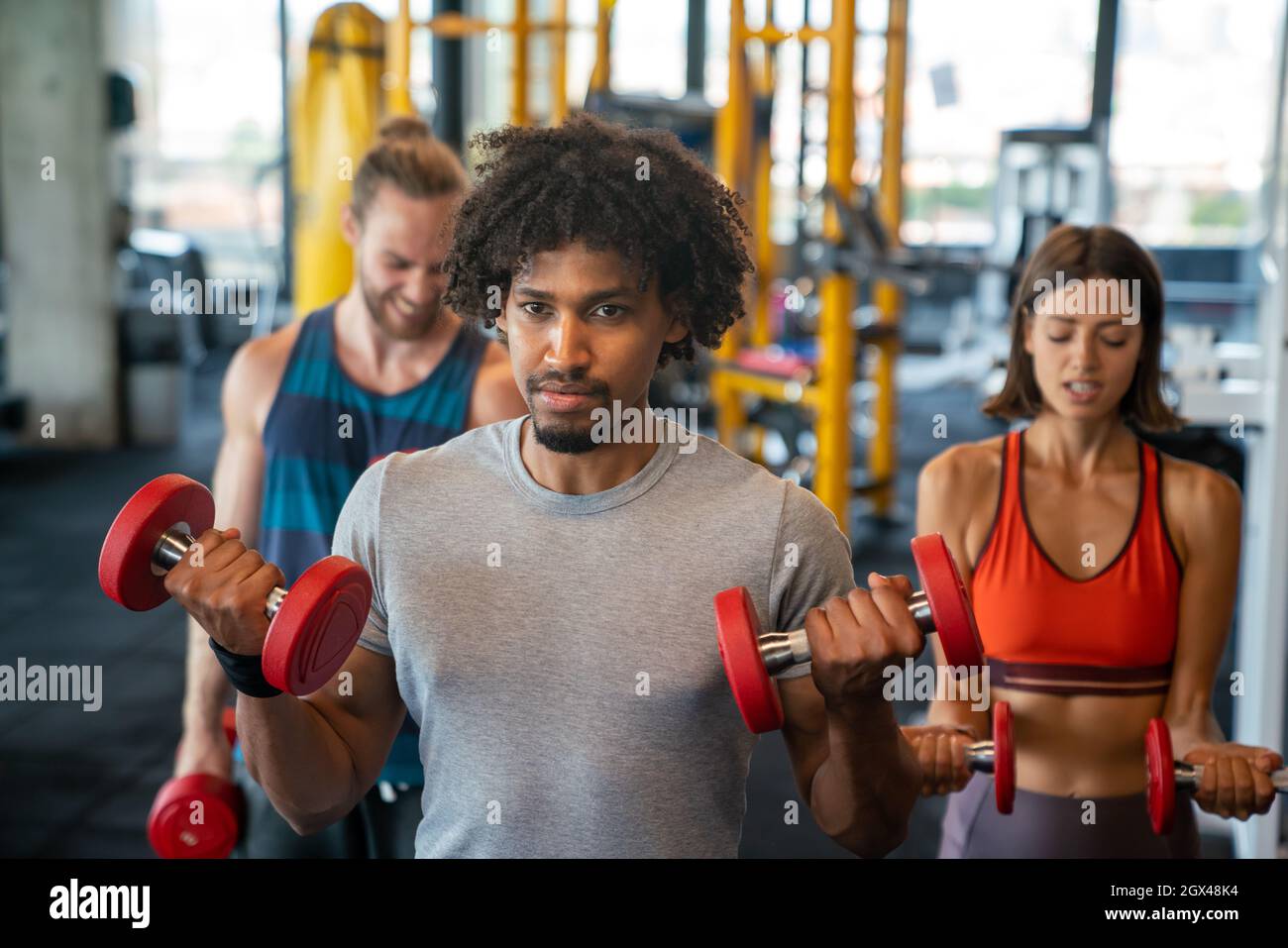 Happy diverse people exercise together in gym to stay healthy Stock ...