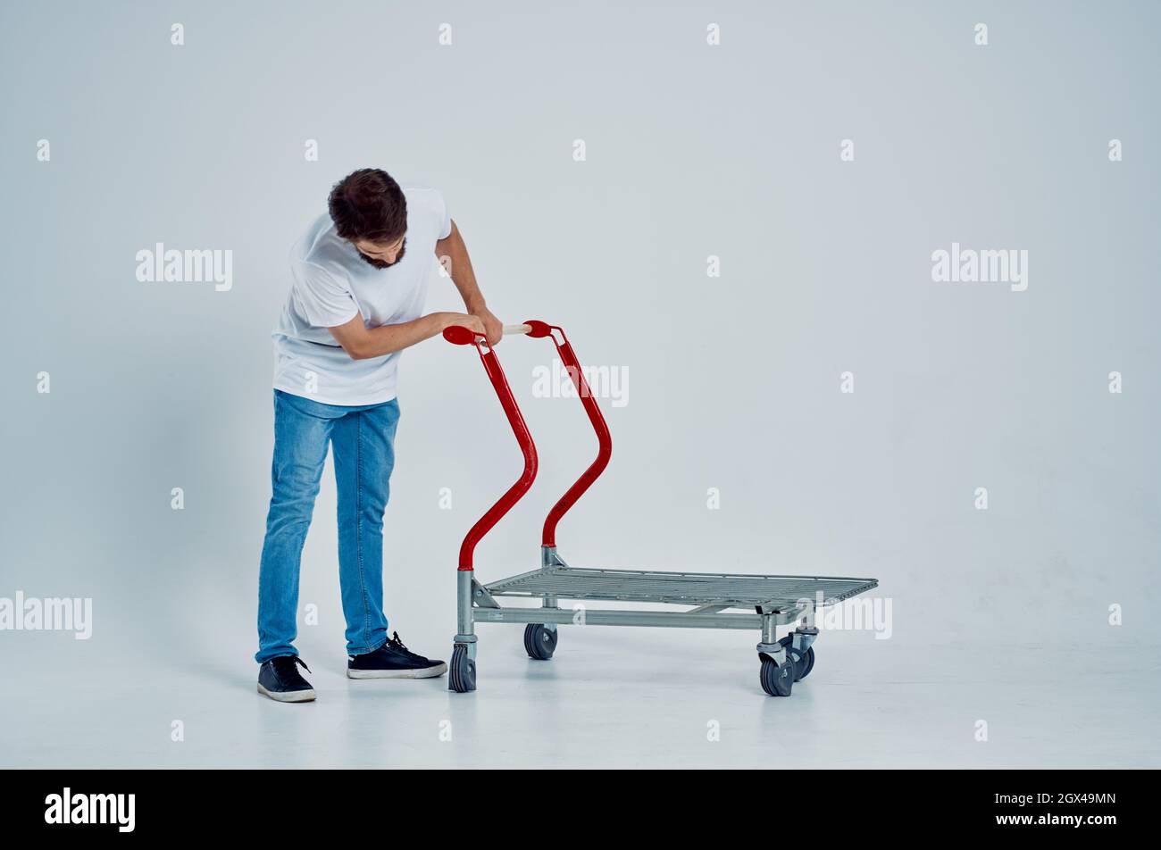 bearded man ride a cart entertainment shipping light background Stock ...