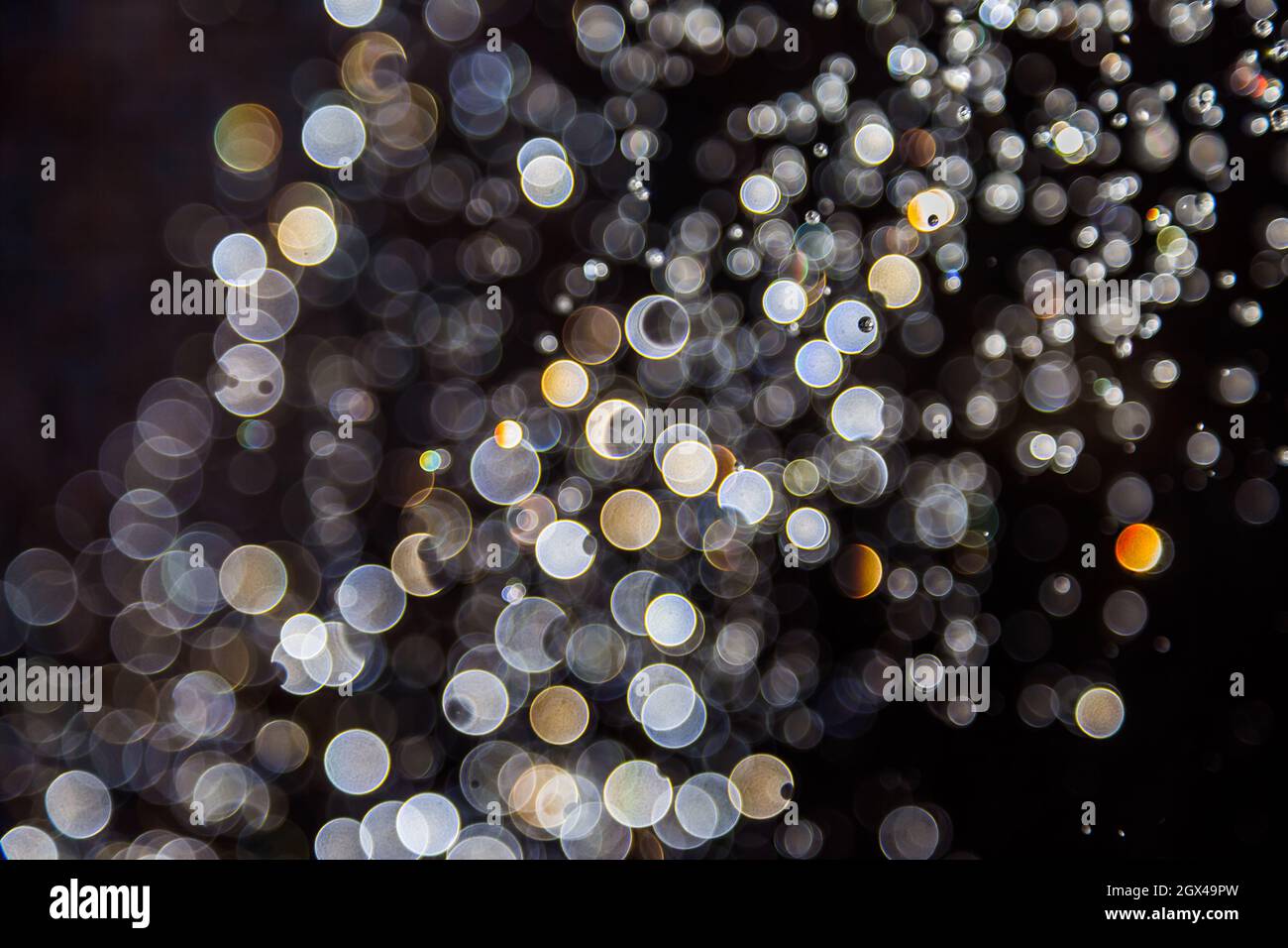 bokeh of water drops levitating in the air reflection with light Stock Photo - Alamy