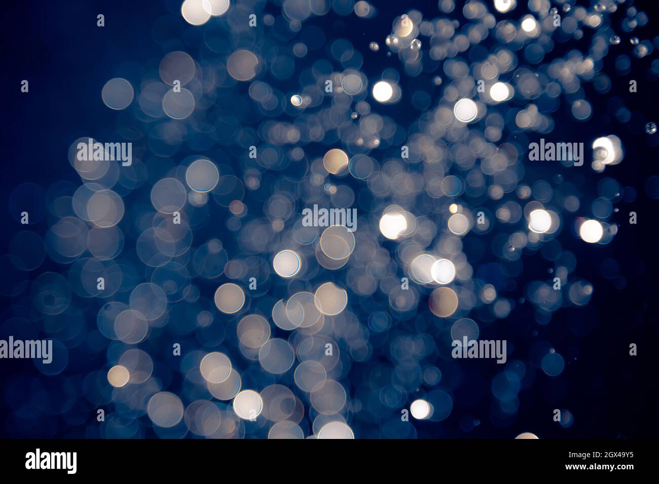 defocus bokeh of water drop on blue background Stock Photo - Alamy