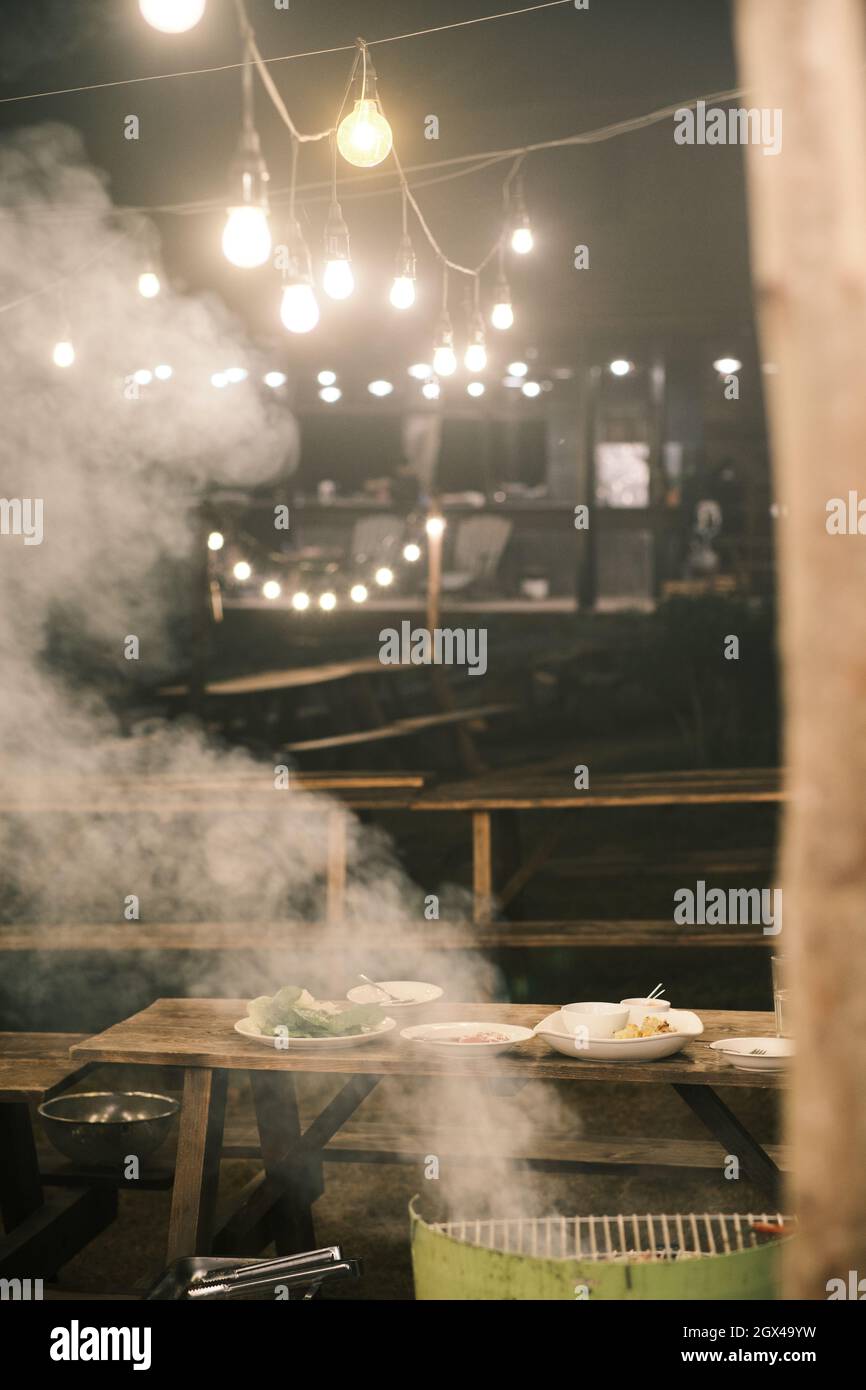 Vertical shot of an outdoor cafe at night Stock Photo - Alamy