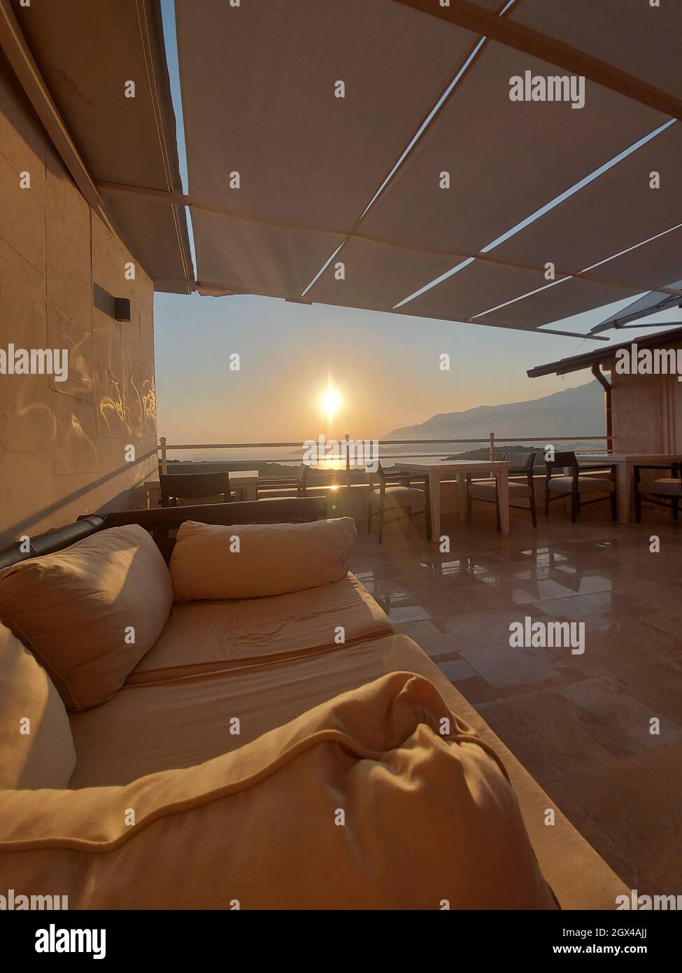 Close up shot from inside of a relaxing area of a beautiful resort on ...
