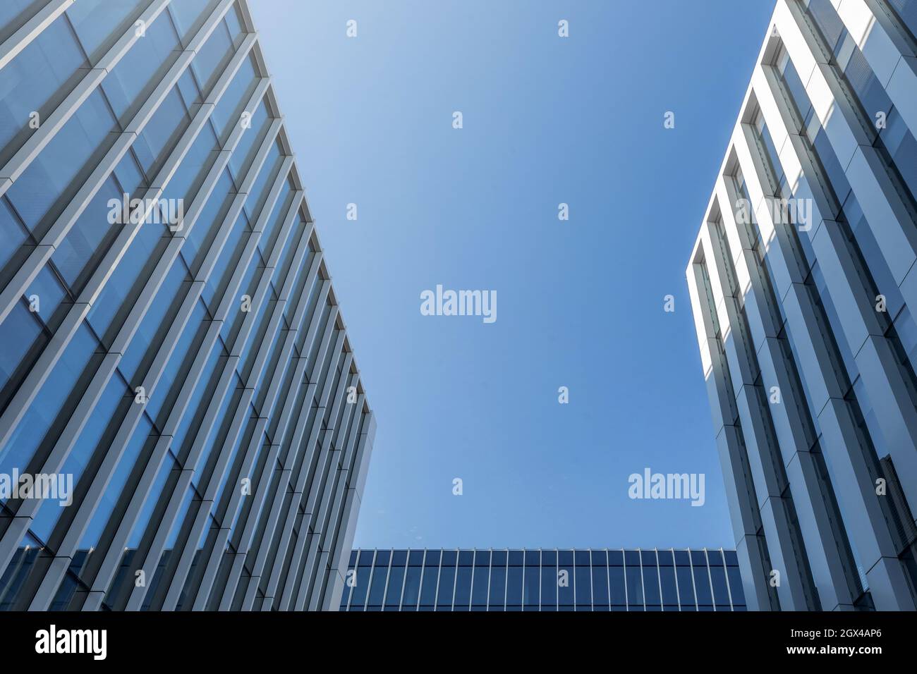 City skyscrapers bottom view against blue sky. Low wide angle shot ...