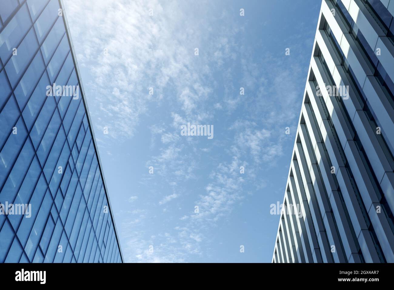 City skyscrapers bottom view against blue sky. Low wide angle shot ...