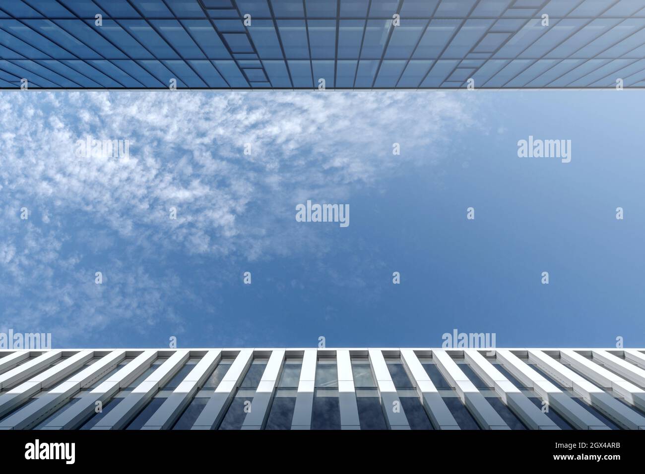 City skyscrapers bottom view against blue sky. Low wide angle shot ...