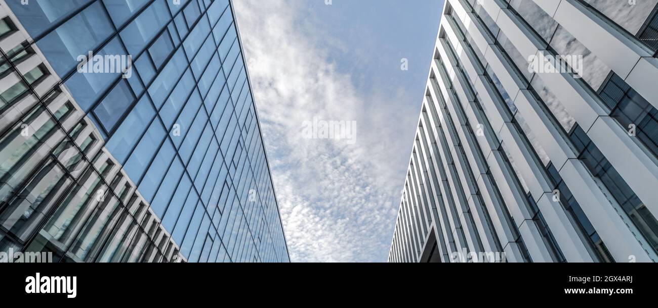 City skyscrapers bottom view against blue sky. Low wide angle shot ...