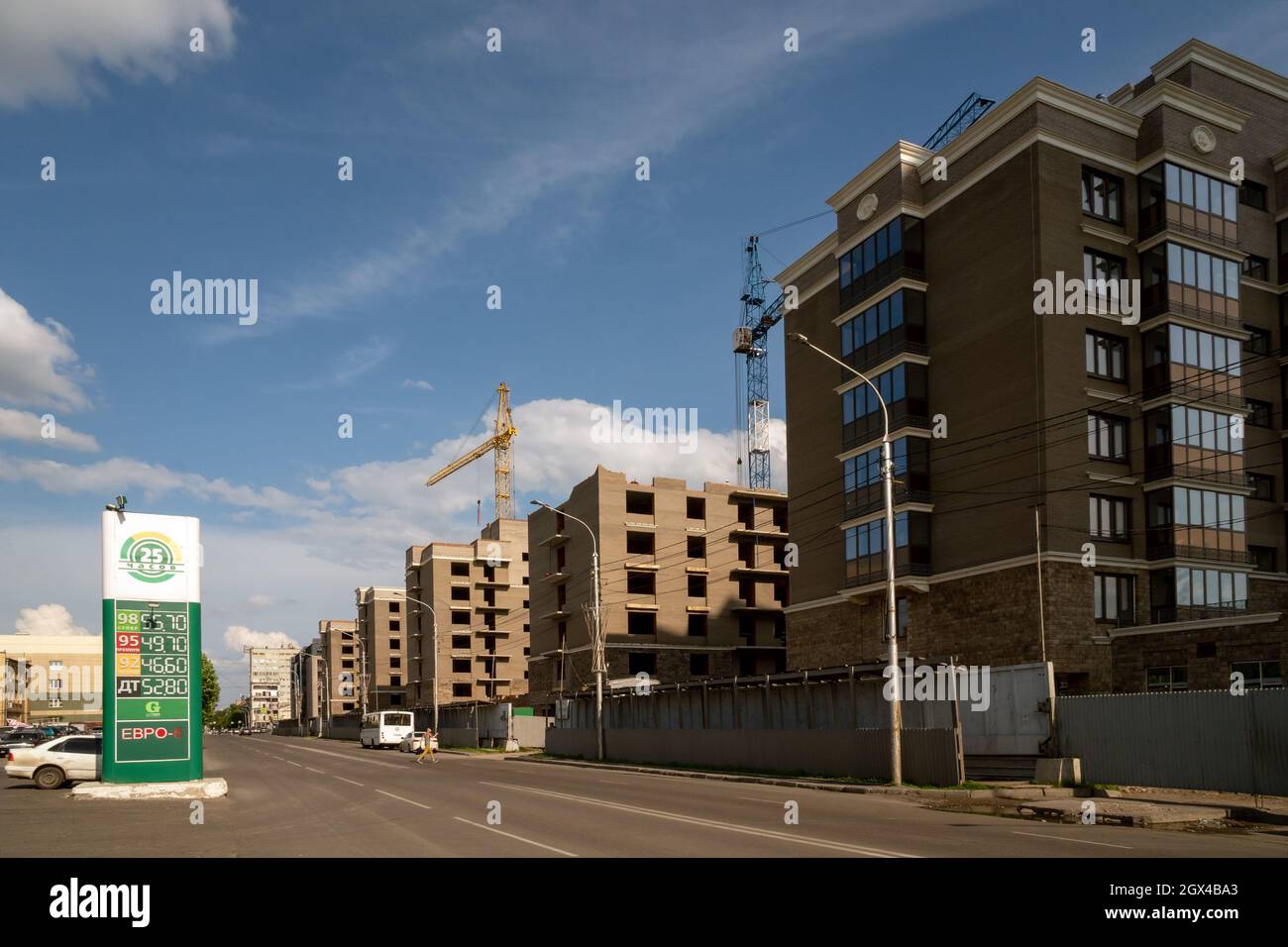 A street with houses under construction on the site of a former combine ...
