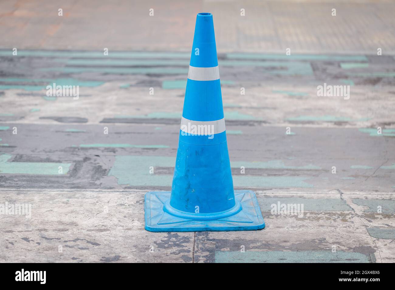 Blue street cone on the street background Stock Photo - Alamy