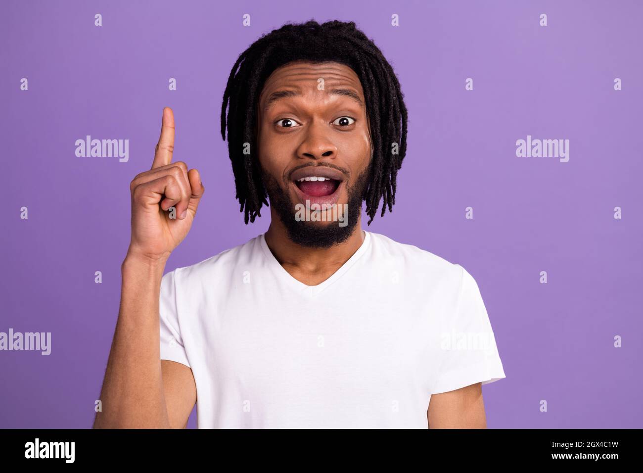 Photo of young happy dark skin cheerful man point finger up idea ...