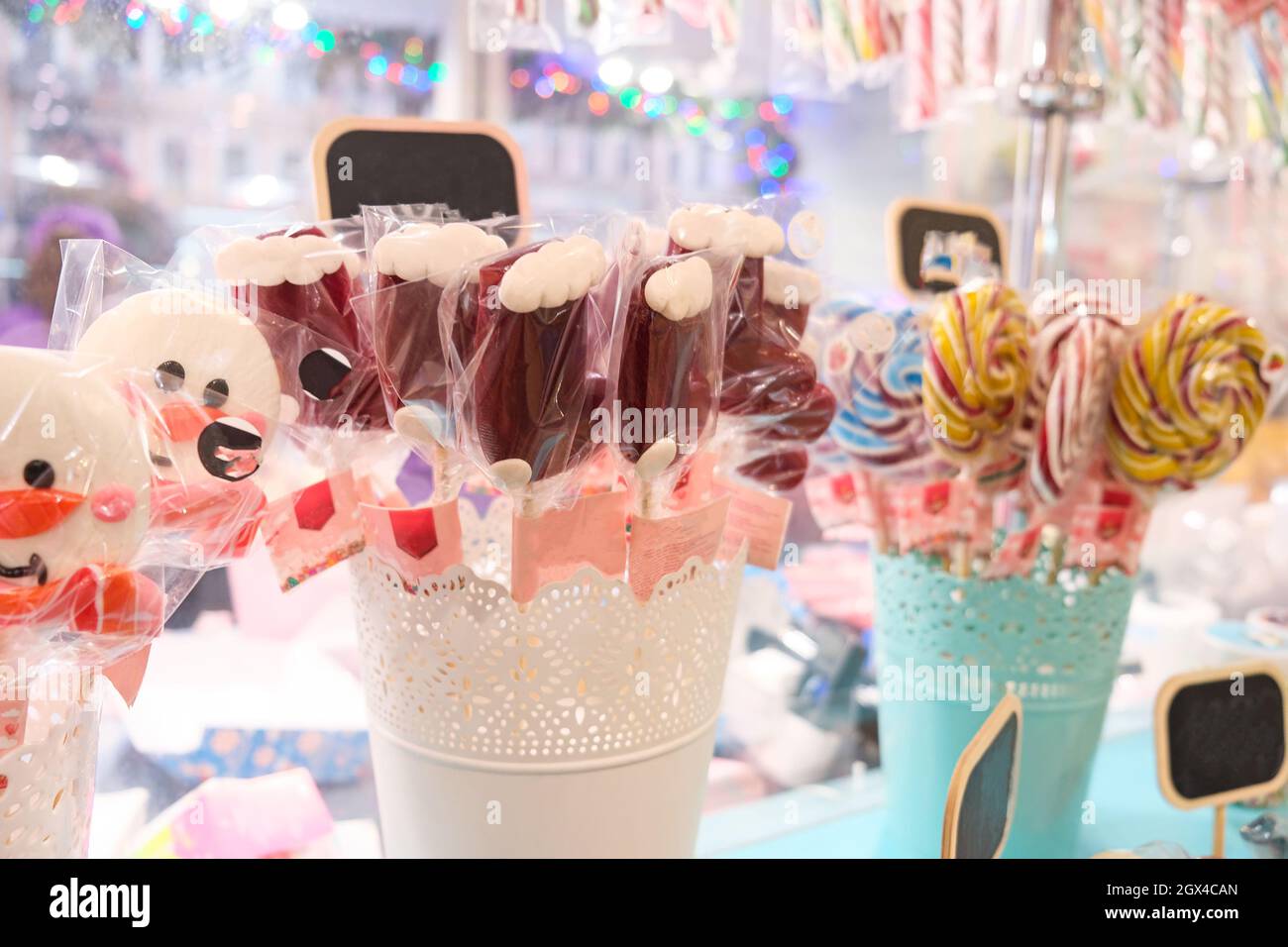 Christmas lollipops in the store during the New Year holidays. tree and ...
