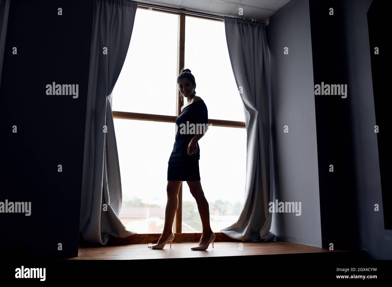 woman posing near window home interior model Stock Photo - Alamy