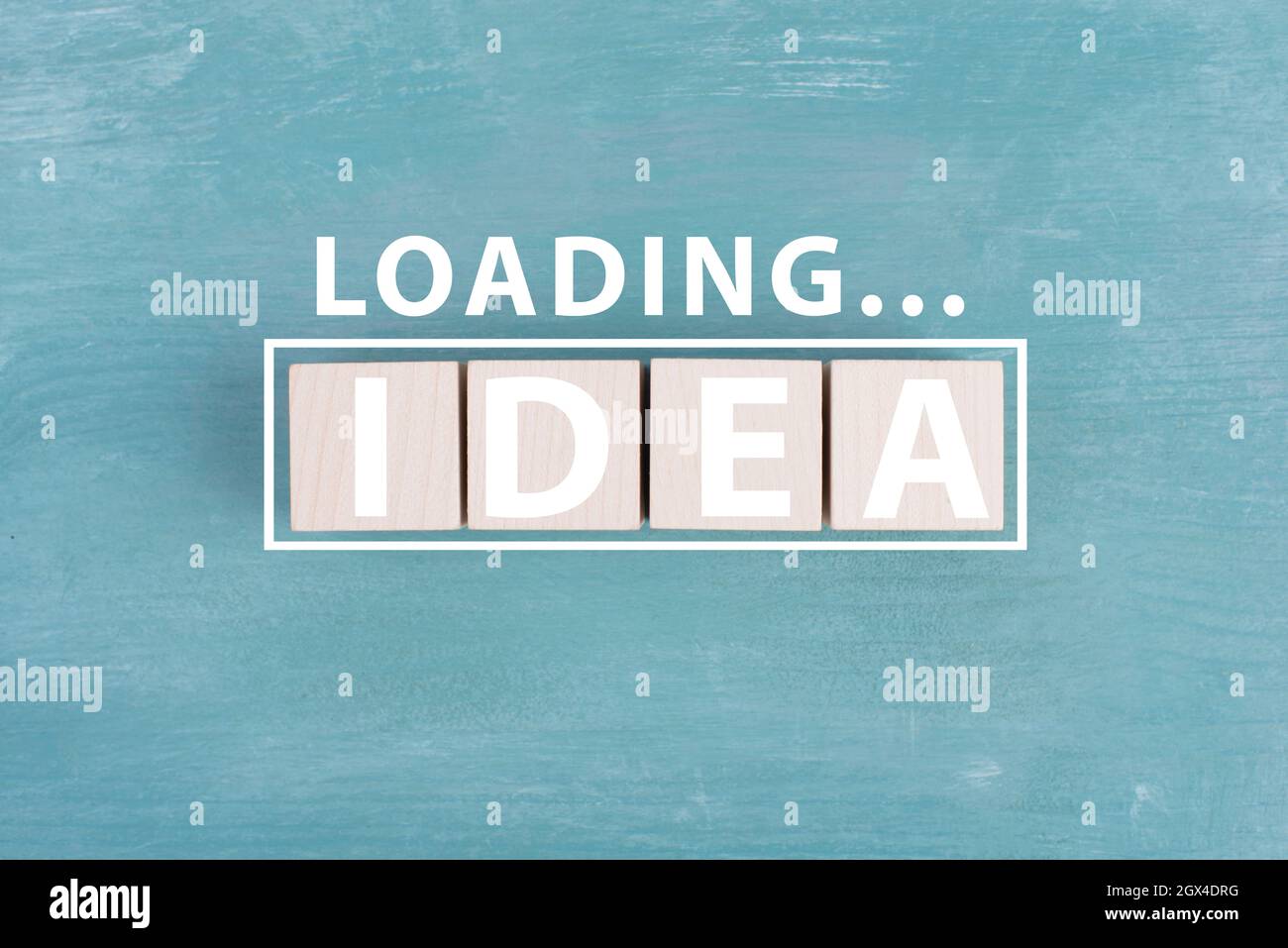 The word idea is standing on wooden cubs in white color, blue ...