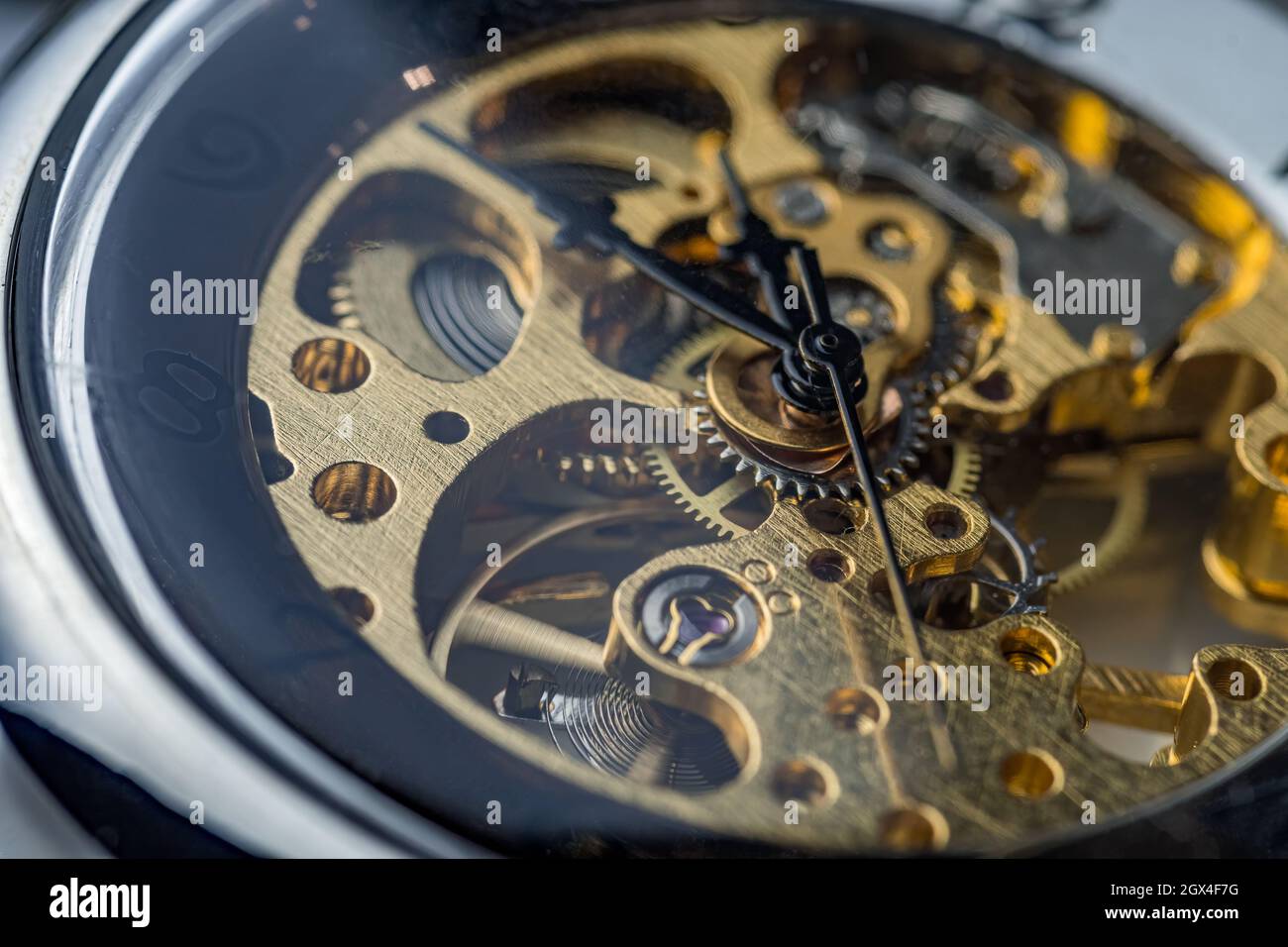 Gears and cogs inside clock. Close-up view on retro watches Stock Photo ...
