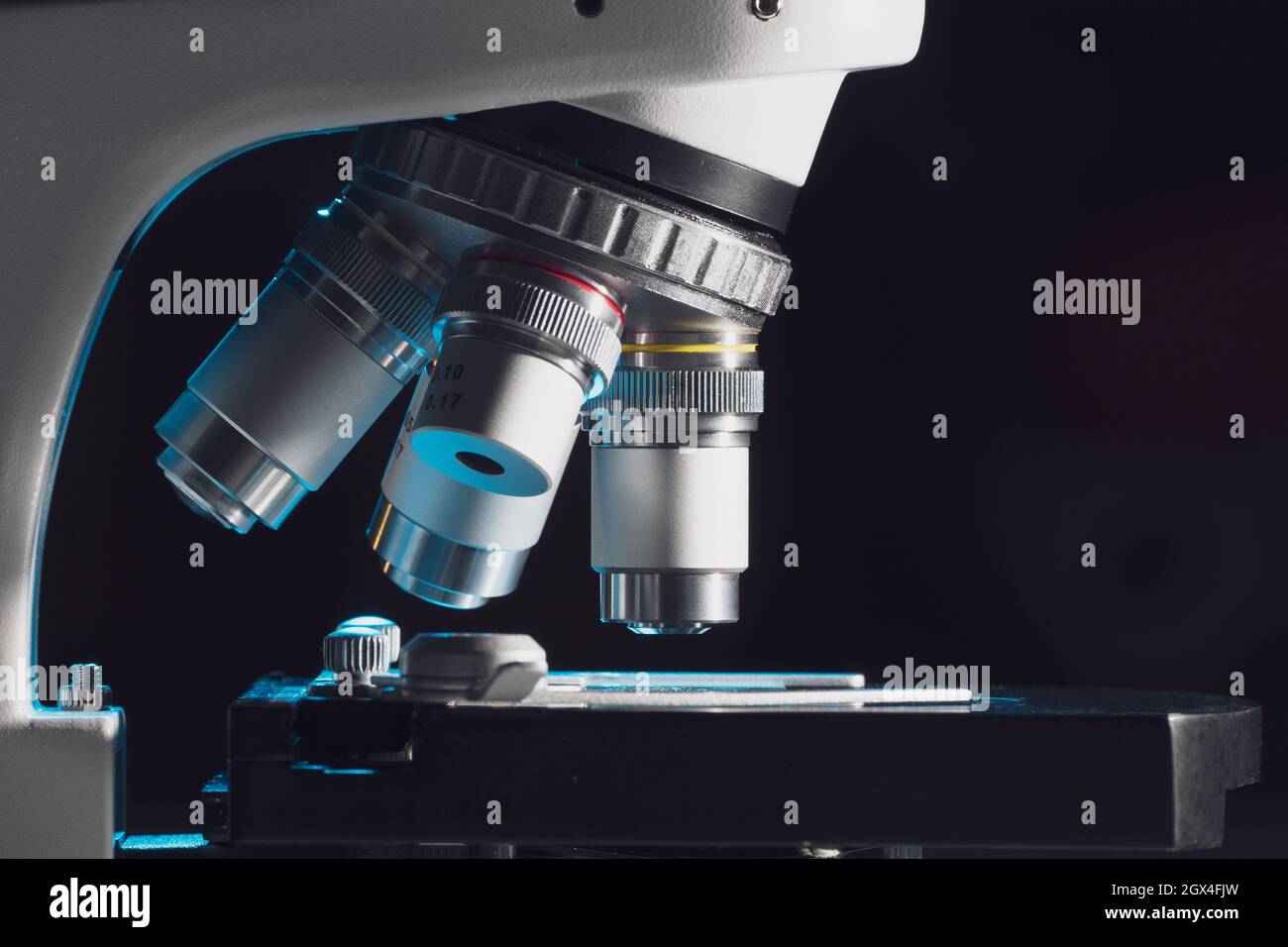 Microscope in laboratory at night. Microbiology and research concept ...