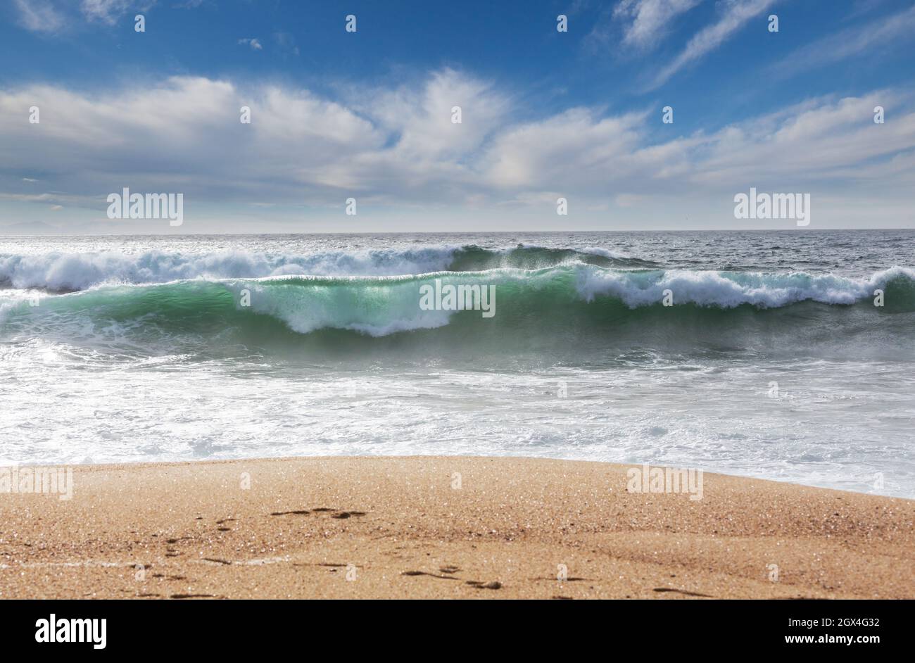 Blue wave on the beach. Dramatic natural background Stock Photo - Alamy