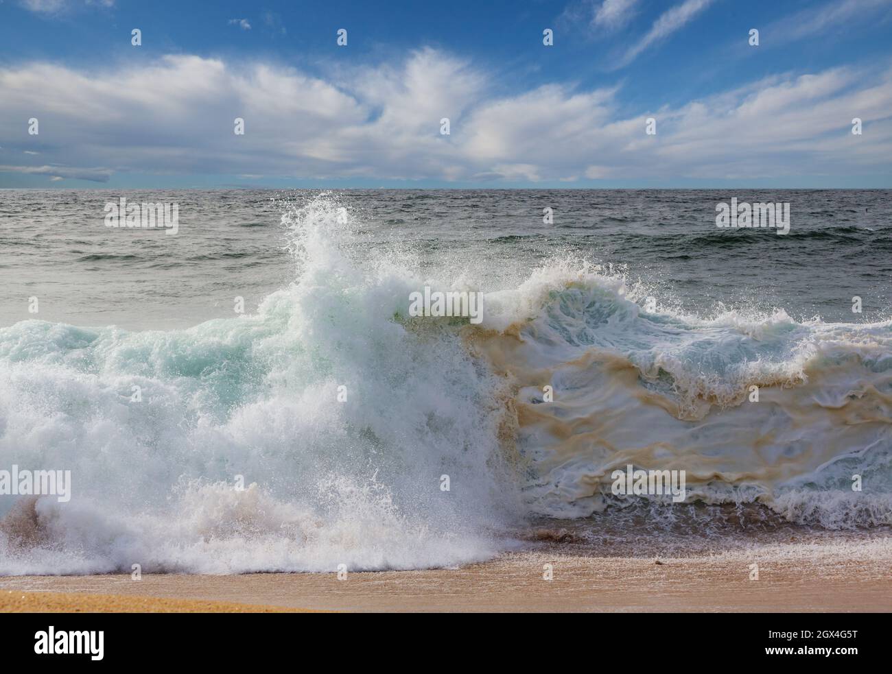 Blue wave on the beach. Dramatic natural background Stock Photo - Alamy