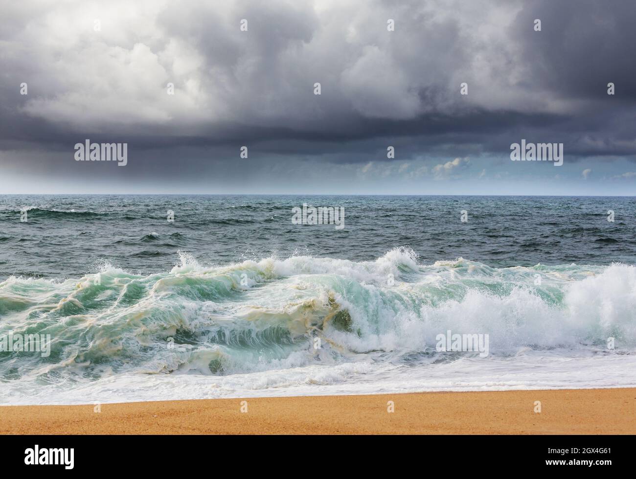 Blue wave on the beach. Dramatic natural background Stock Photo - Alamy