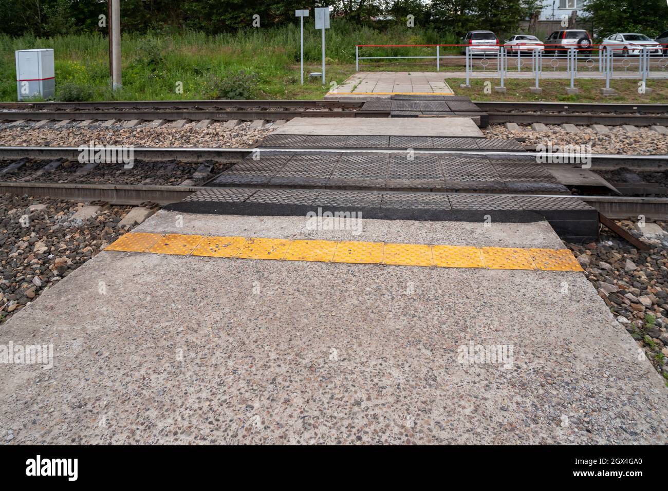 A pedestrian crossing made of non-slip rubber laid across the railroad ...