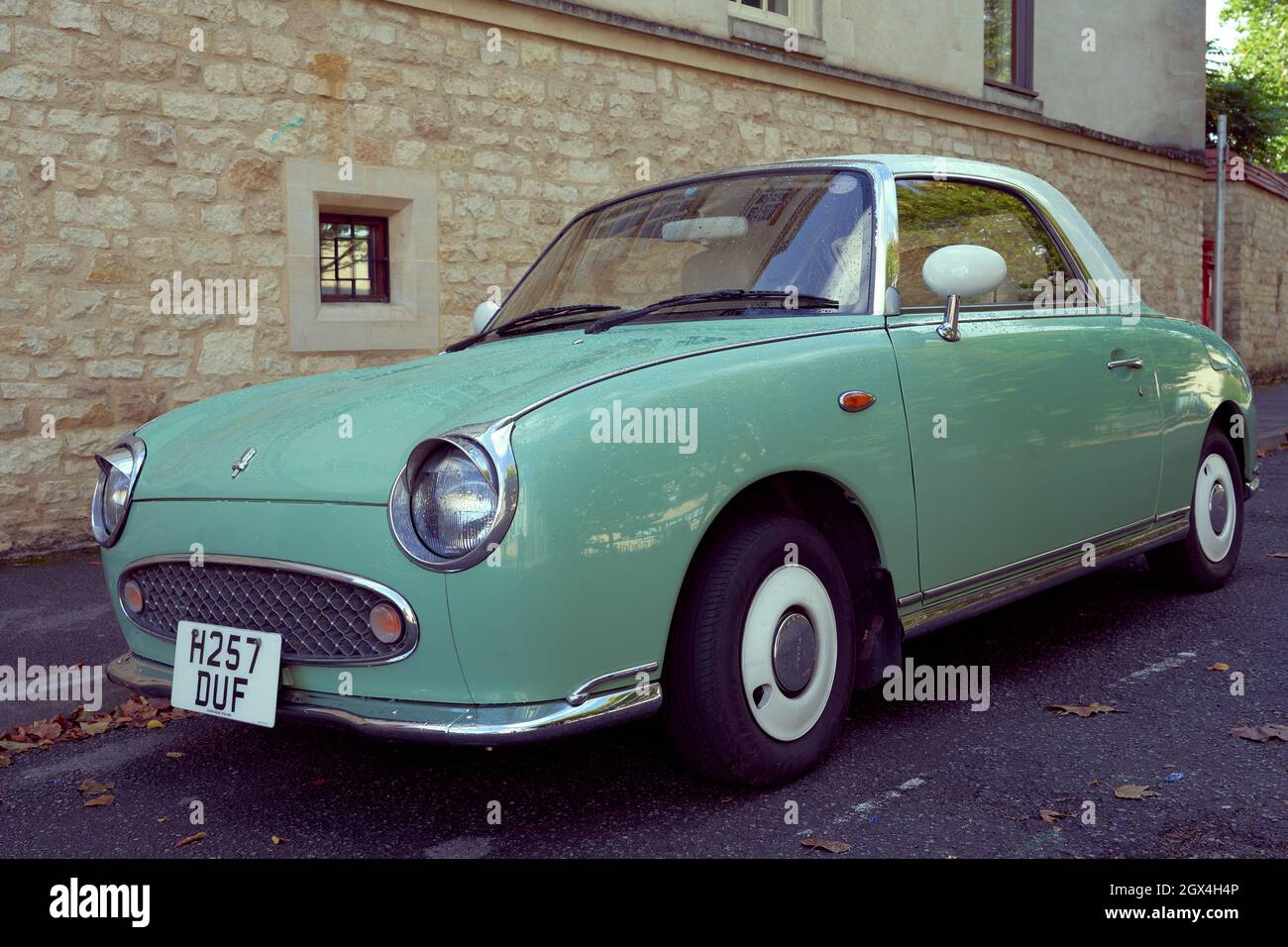 A Nissan Figaro sports car parked on a side street in Oxford Stock ...