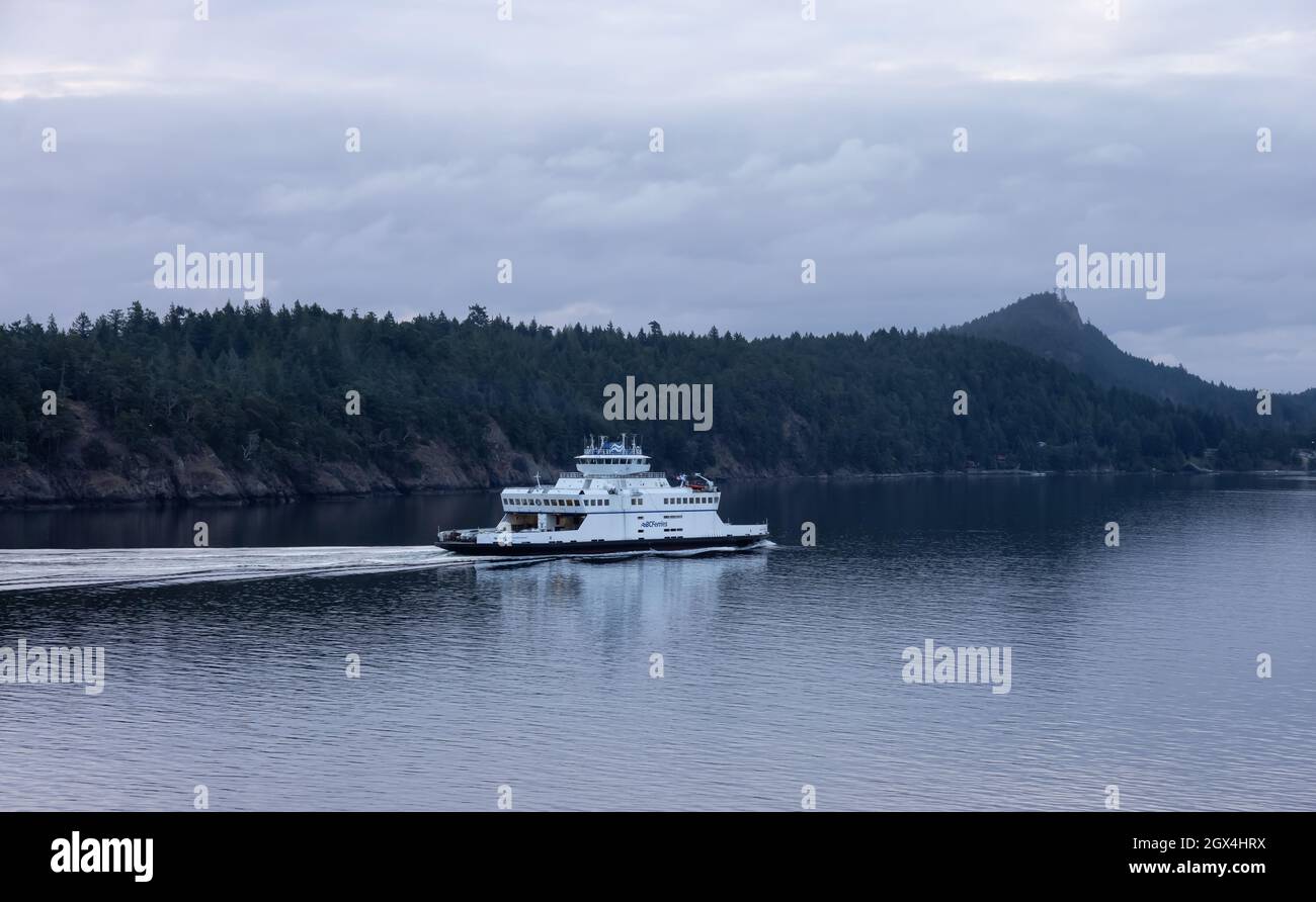 BC Ferries Boat in Pacific Ocean during cloudy summer morning sunrise ... BC Ferries Boat in Pacific Ocean during cloudy summer morning sunrise ...