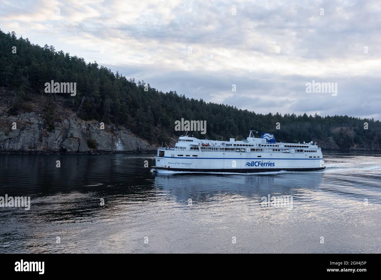 BC Ferries Boat in Pacific Ocean during cloudy summer morning sunrise ...