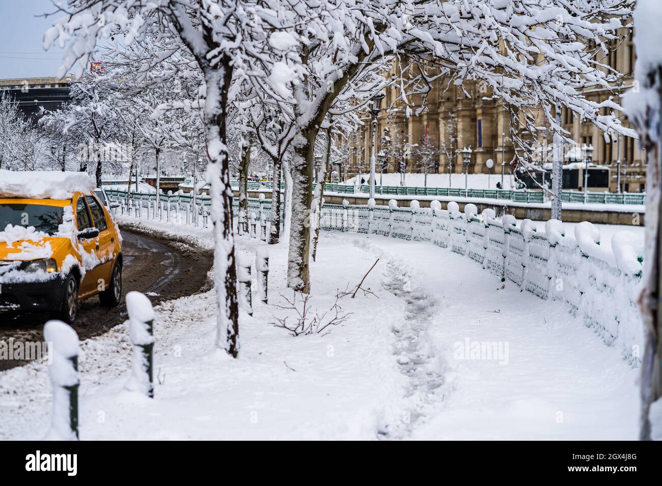 BUCHAREST, ROMANIA - Jan 19, 2021: A snowy road in Bucharest, Romania ...
