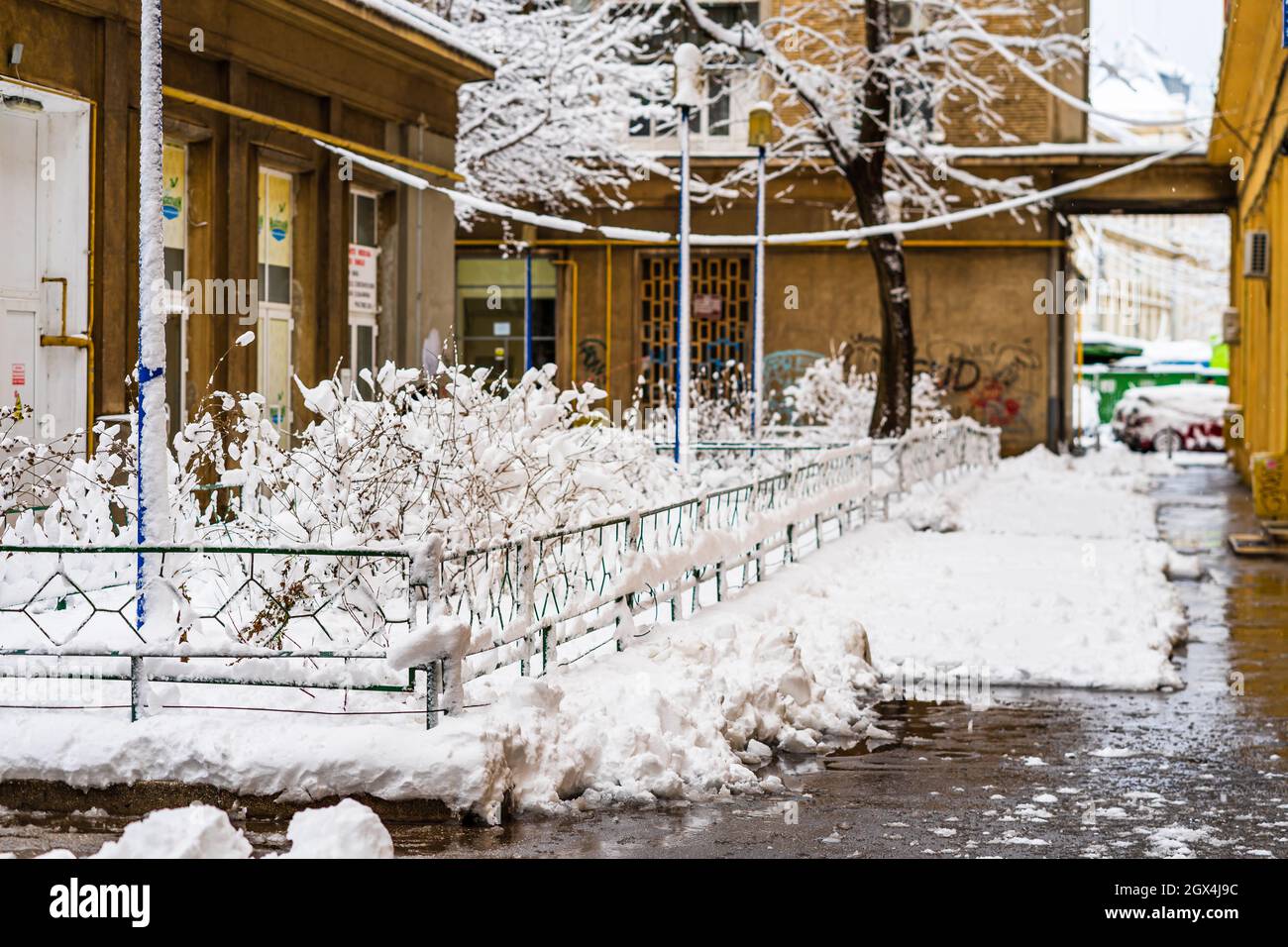 BUCHAREST, ROMANIA - Jan 19, 2021: A snowy street in Bucharest, Romania ...