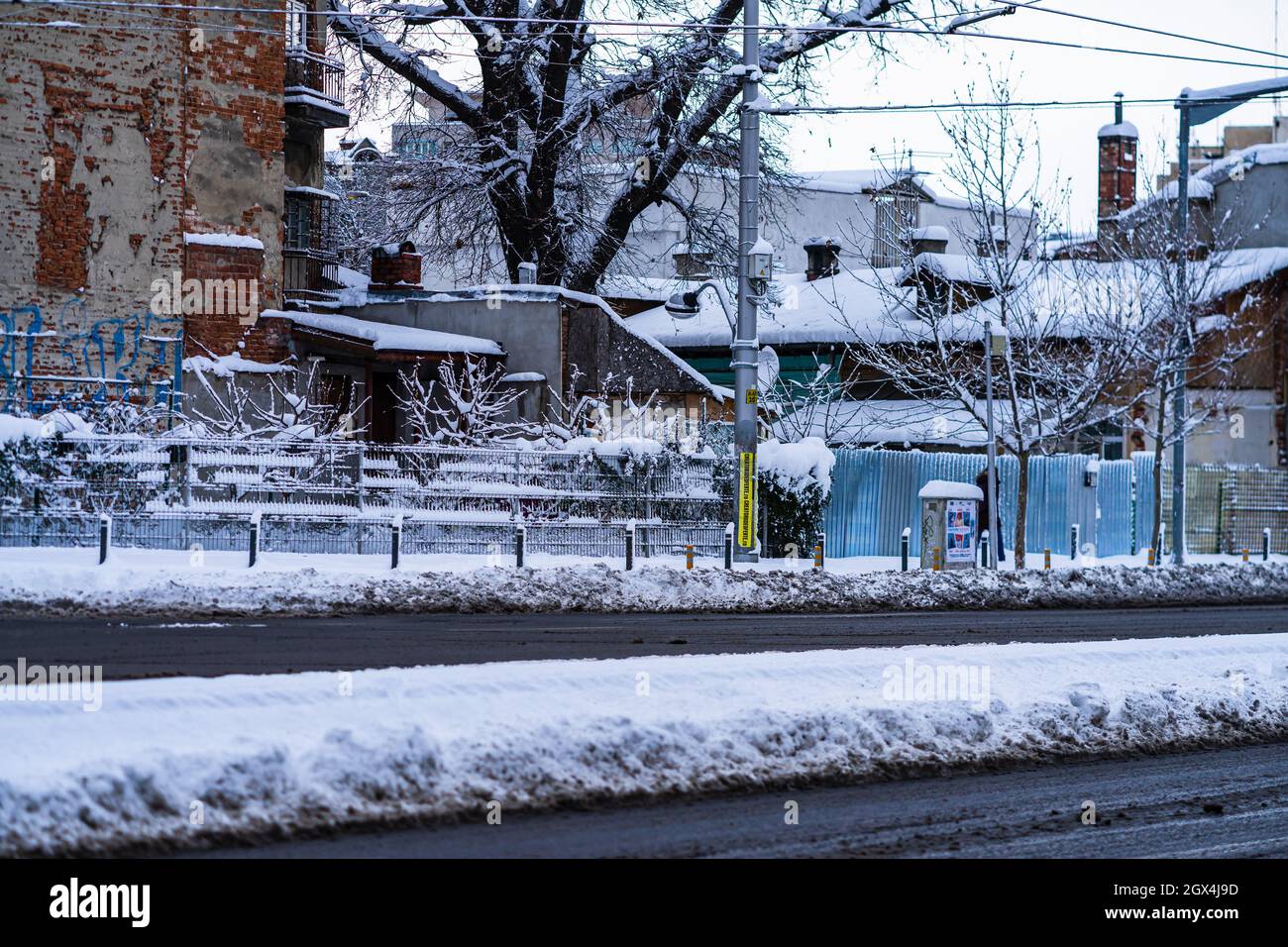 BUCHAREST, ROMANIA - Jan 19, 2021: A snowy road in Bucharest, Romania ...