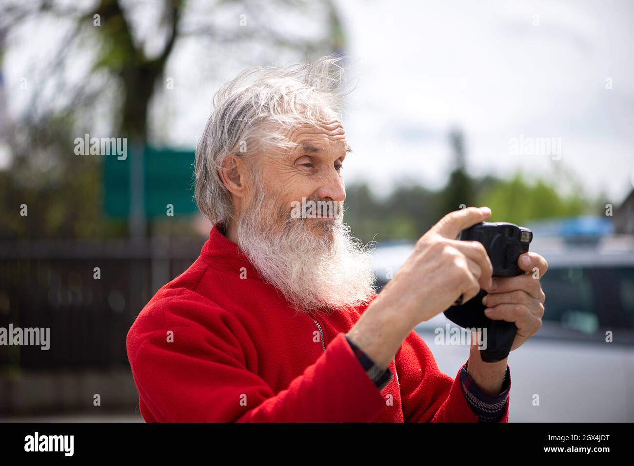 Close-up face portrait of bearded senior man photographer with old ...