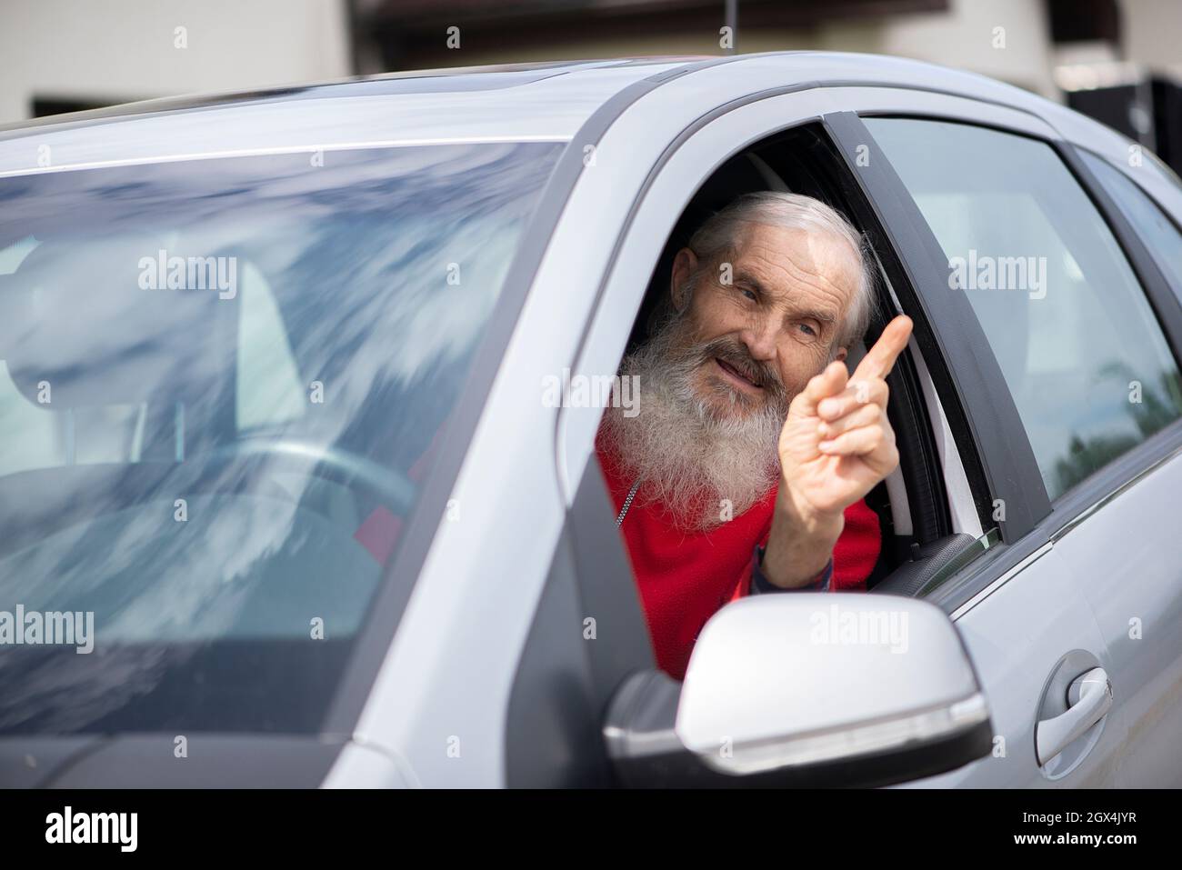 Senior man driver in car. Emotional portrait of an expressive and ...