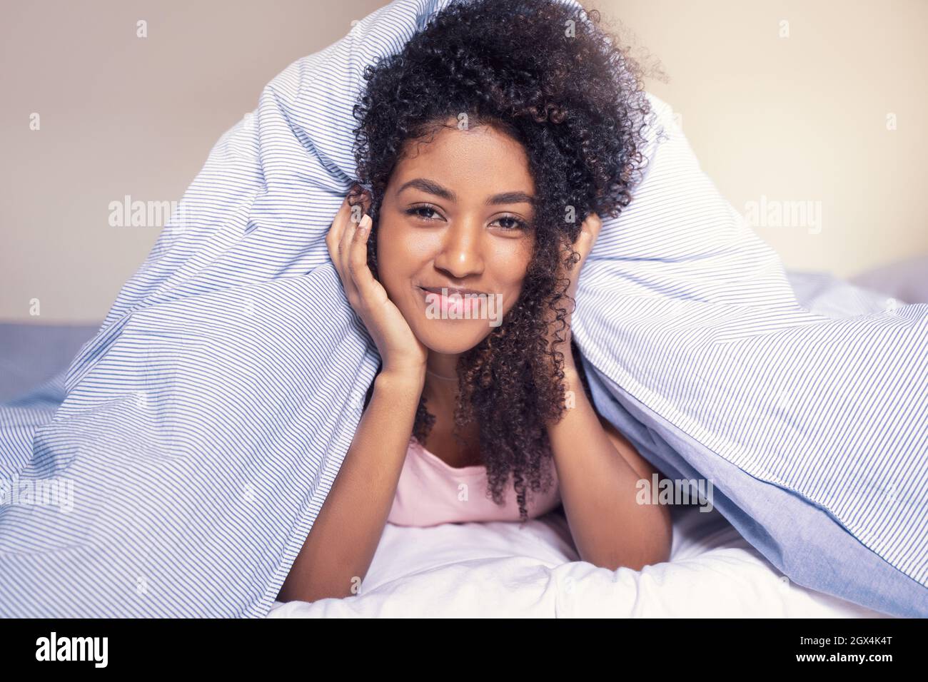 African american girl waking up in bed hi-res stock photography and ...