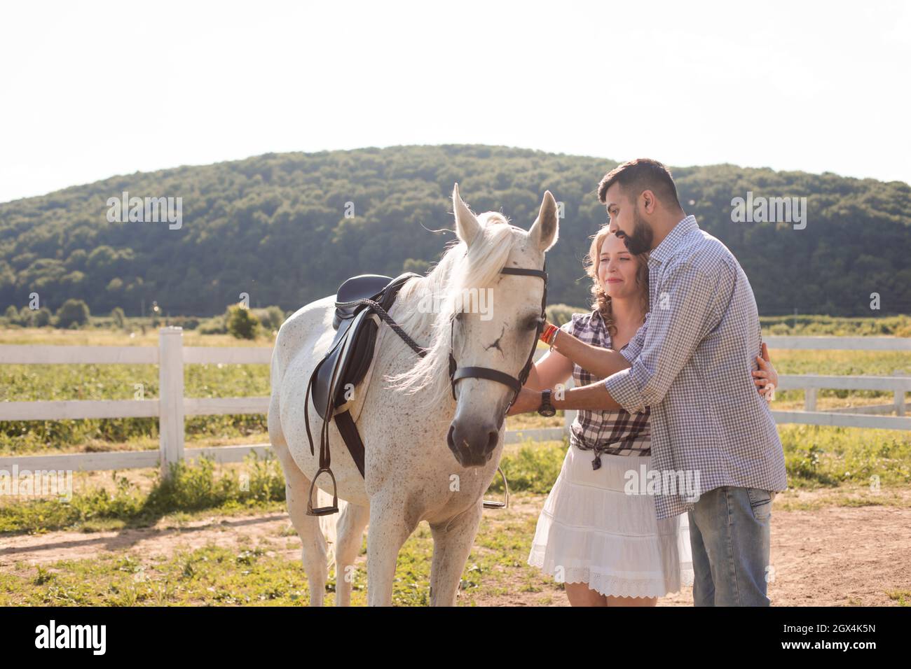 The couple in love spending time together on a ranch Stock Photo - Alamy