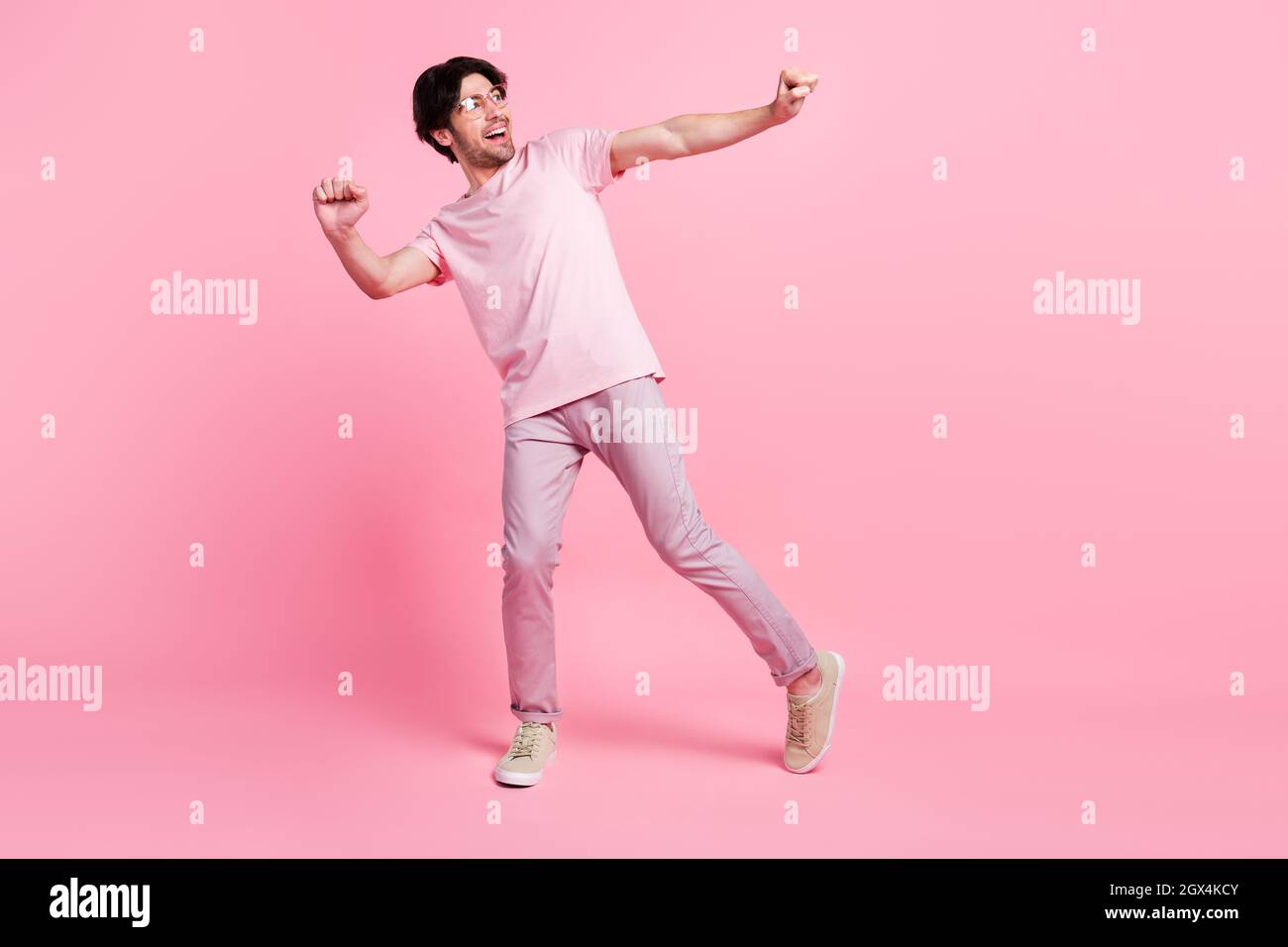 Full length photo of young man happy positive smile have fun dance ...