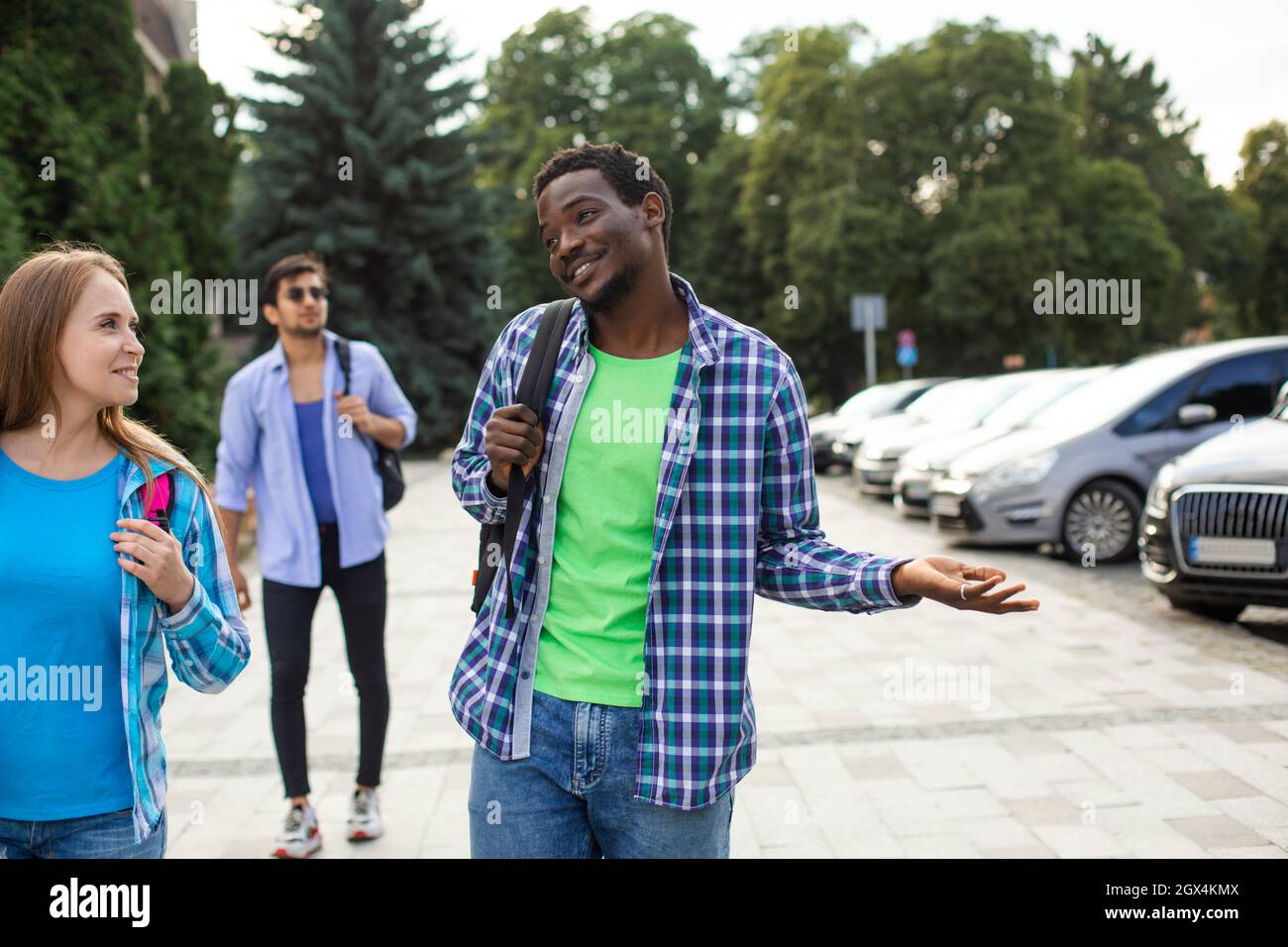 Group of high school students talking and laughing Stock Photo - Alamy