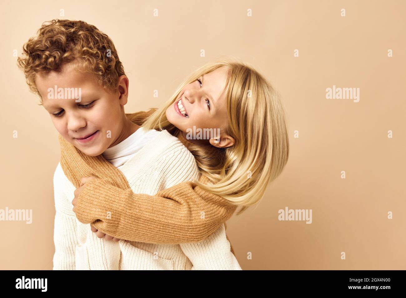 children friendship rides on the back childhood beige background Stock ...