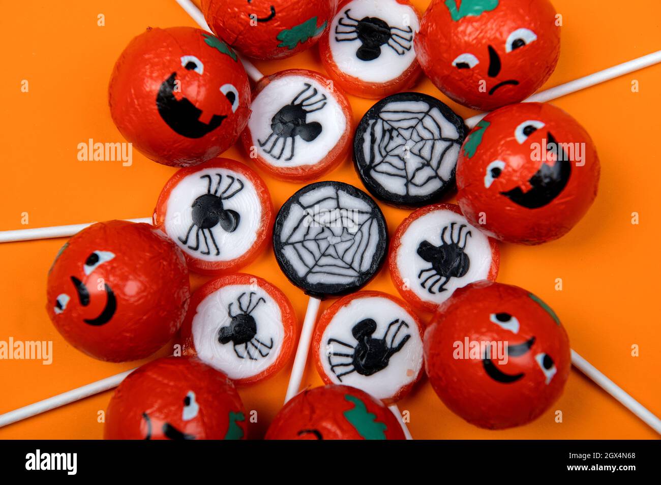 Halloween candy with black spiders,cobweb,smiling and angry pumkins on ...