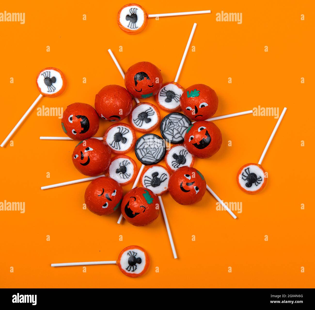 Halloween candy with black spiders,cobweb,smiling and angry pumkins on ...