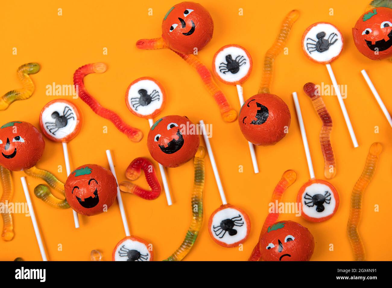 Halloween candy with black spiders,cobweb,smiling pumpkins and tasty ...