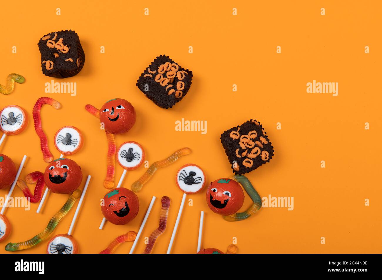 Halloween candy with black spiders,cobweb,smiling pumpkins and tasty ...