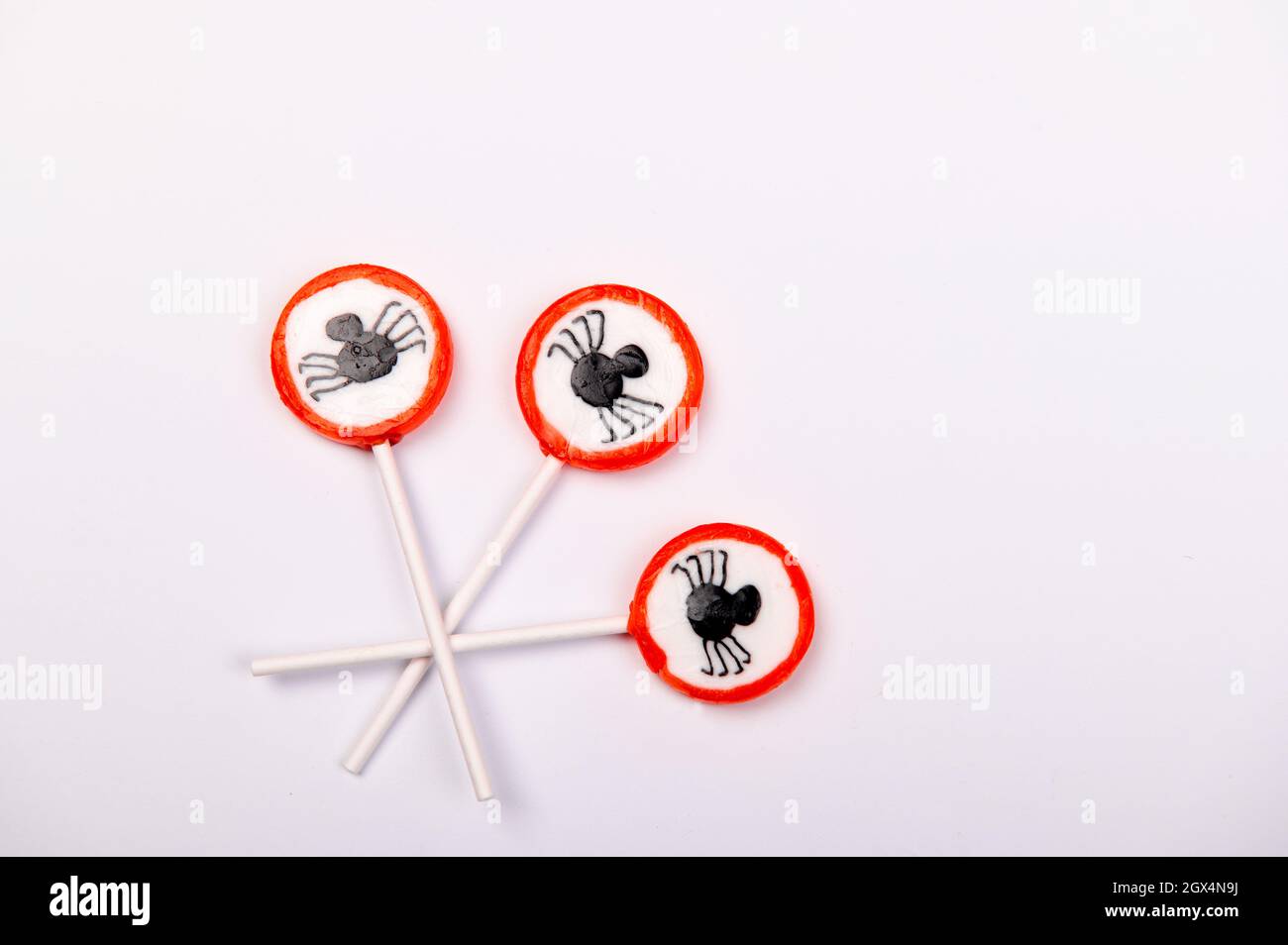 Halloween candy with black spiders isolated on white background Stock ...