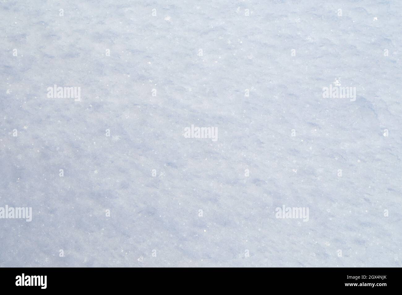 Close-up of fresh snowy land in the winter, viewed from above. Abstract ...